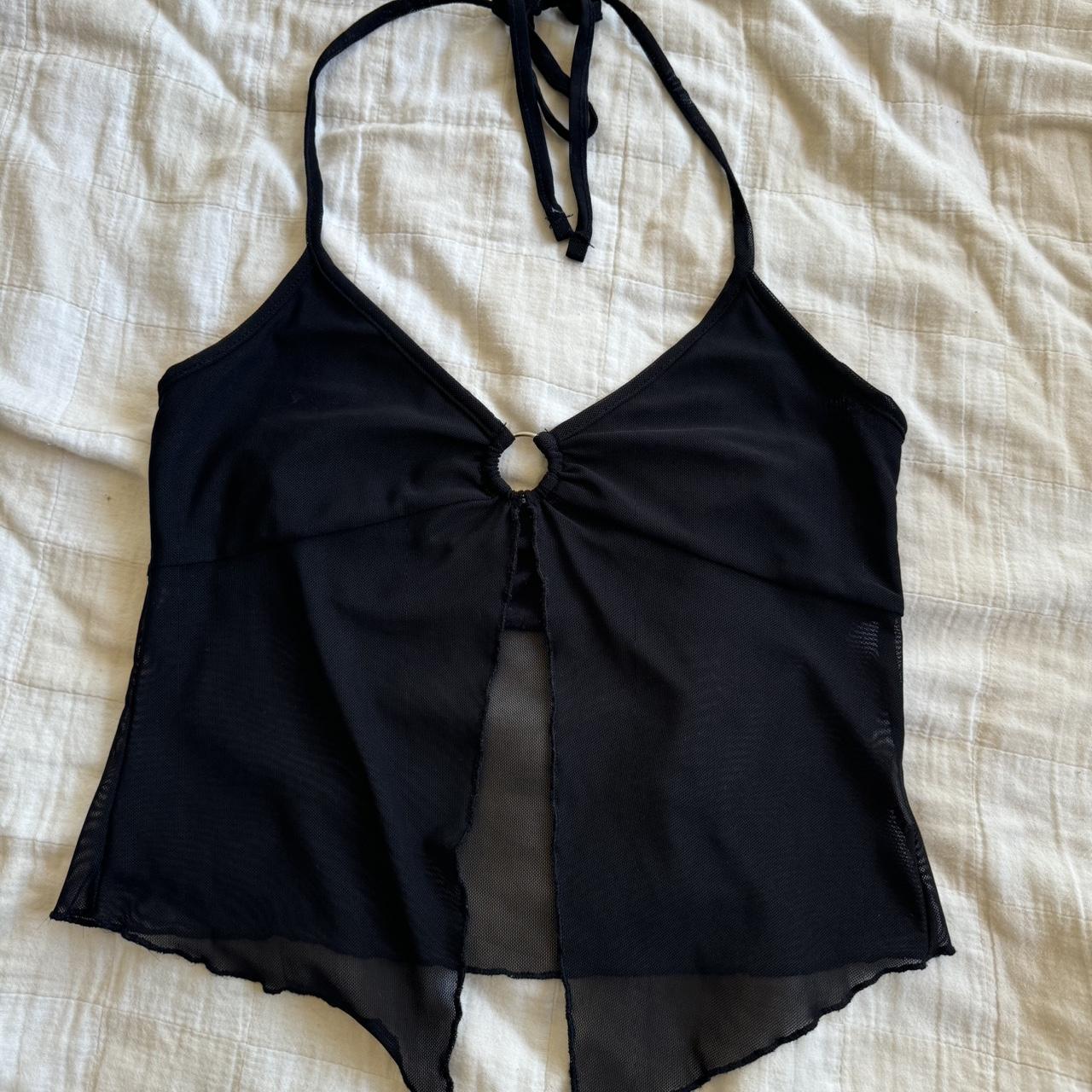 Black halter top with split detail and a cute silver... - Depop
