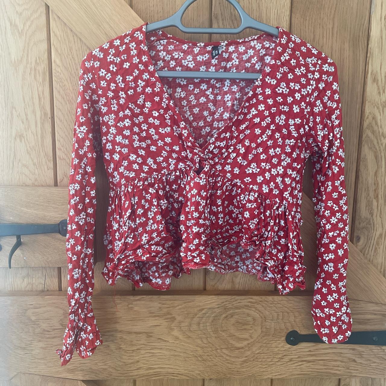 Cropped red floral top with twist cut out... - Depop