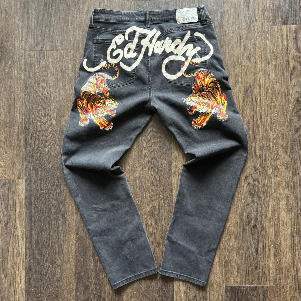 Ed Hardy black and orange jeans with Tiger design on... - Depop