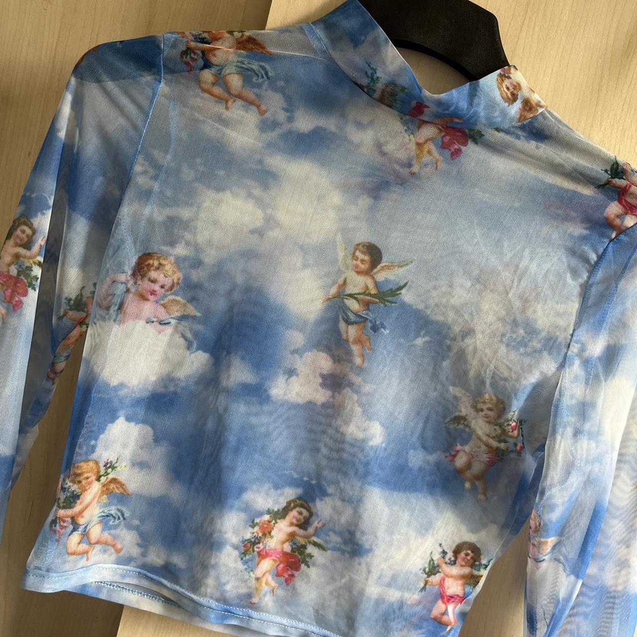 Mesh sheer angel print top Slightly cropped Mock... - Depop