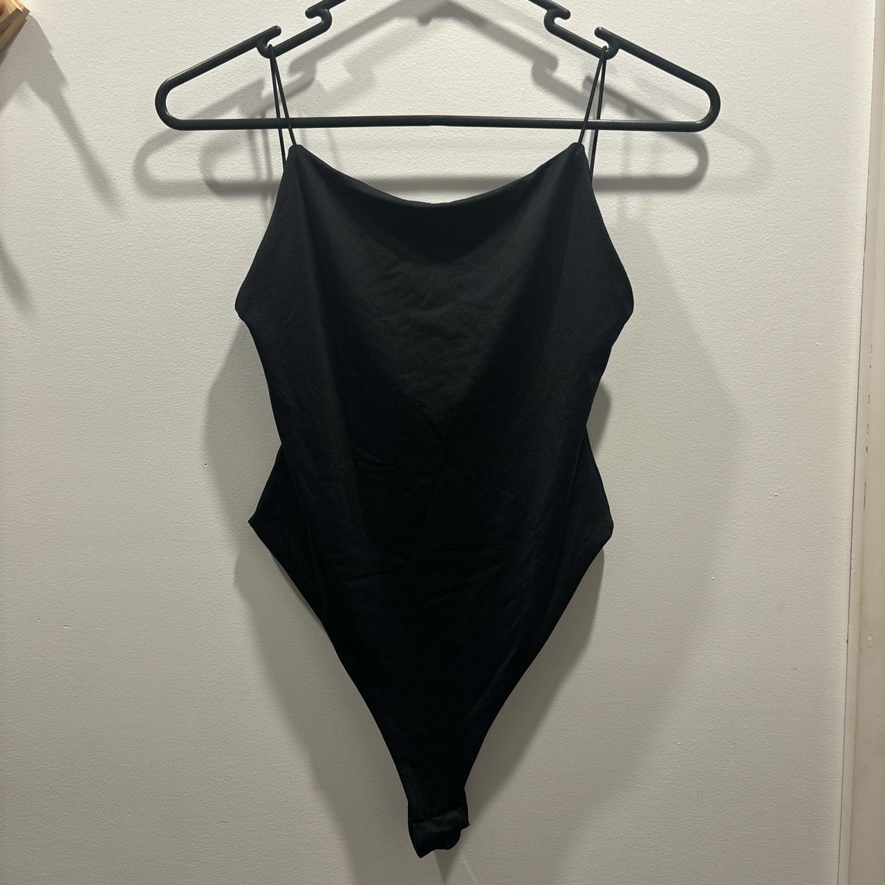 Supre low cut back body suit. Never worn. Size xs - Depop