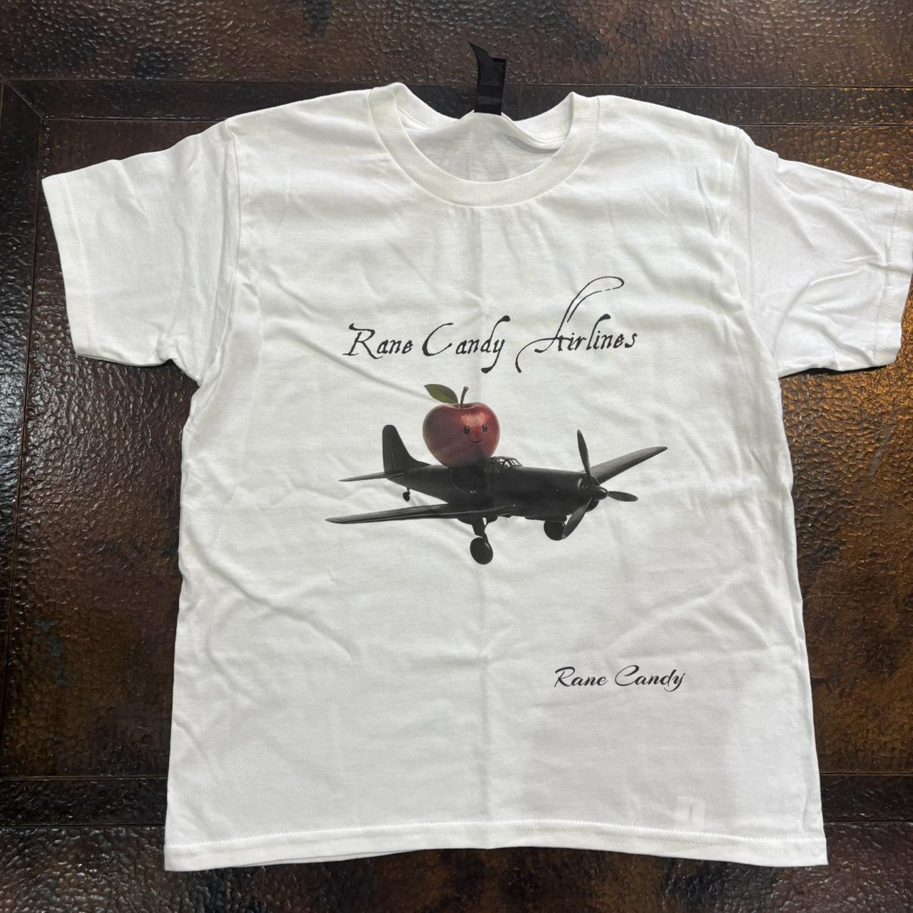 Apple on black airplane Rane Candy Airlines spell... | Depop