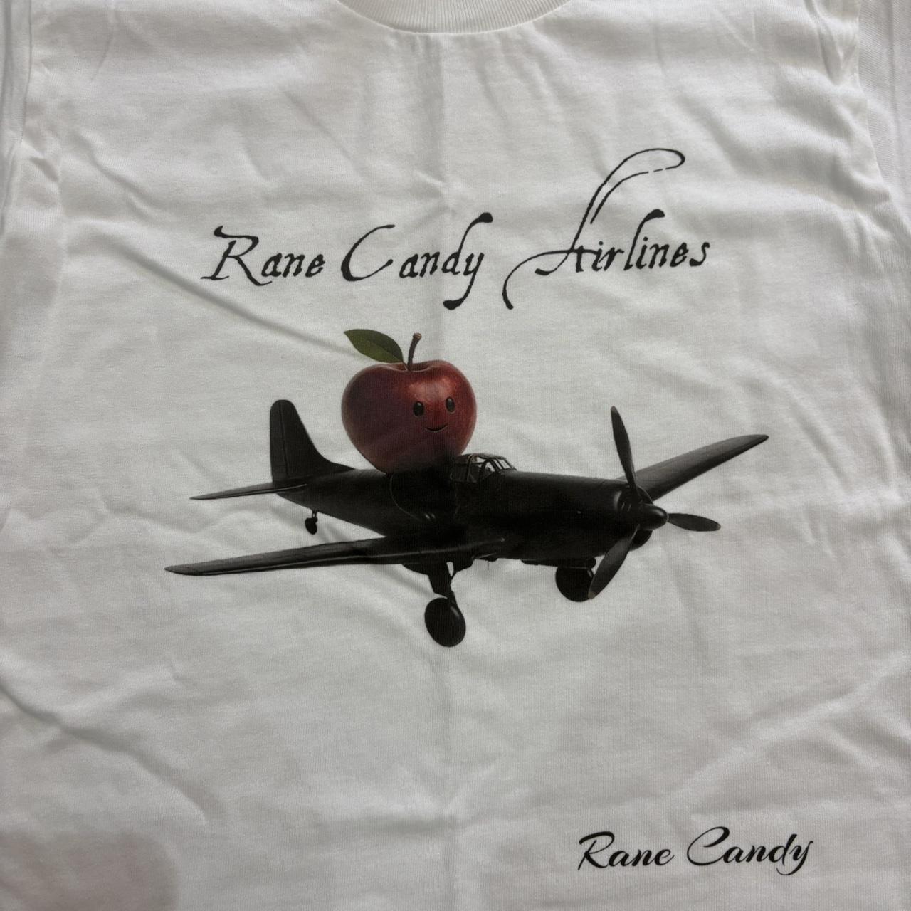 Apple on black airplane Rane Candy Airlines spell... | Depop