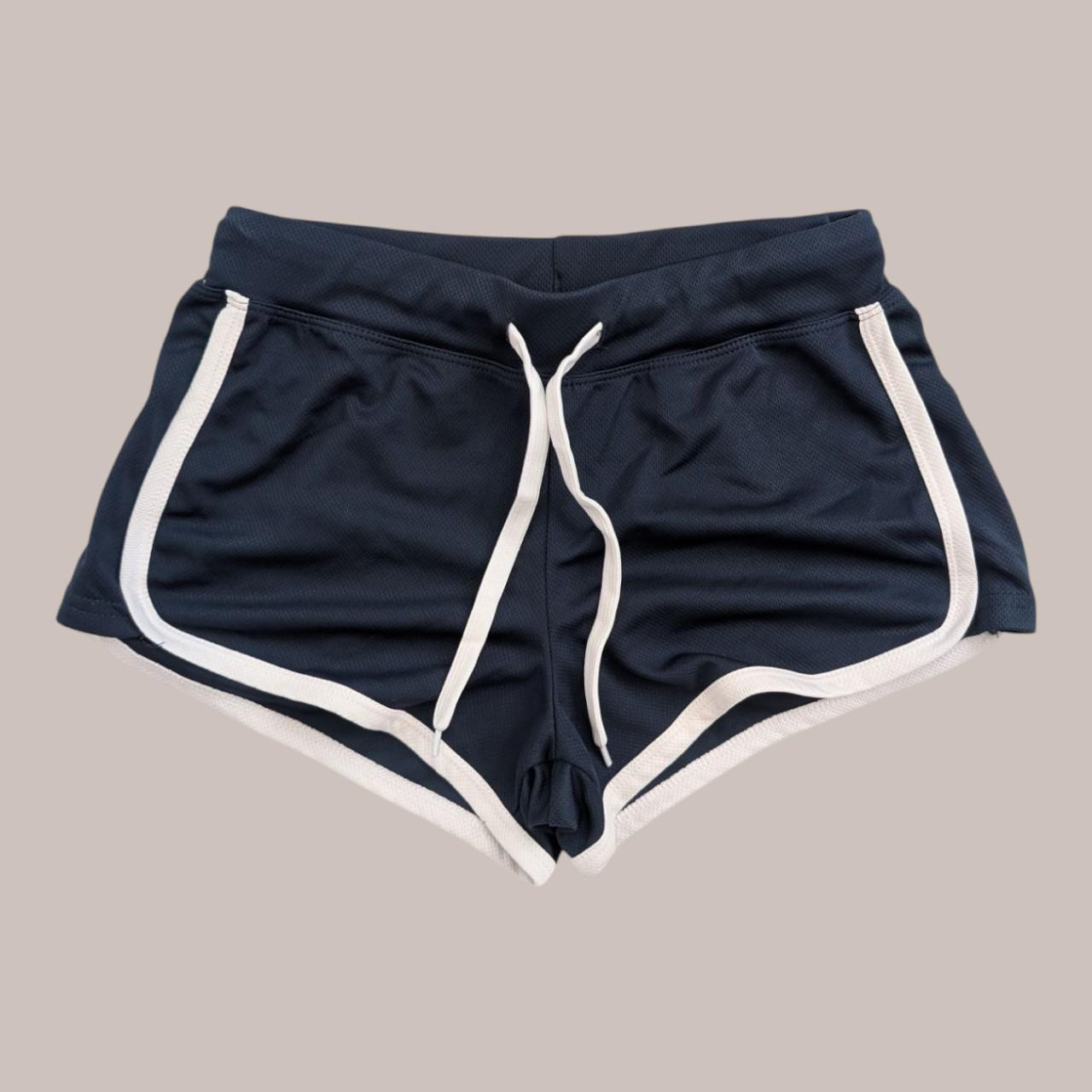 Navy blue and white dolphin shorts with elastic... | Depop