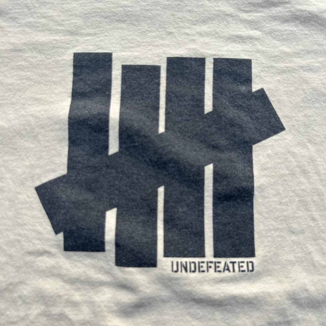 Undefeated classic logo t shirt Size tag cut fits... - Depop