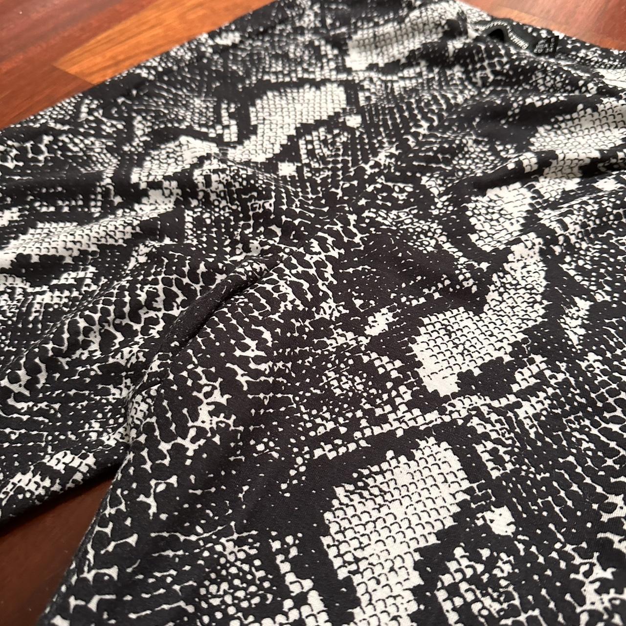 Stretchy high waisted flare leg snake pattern pants.... - Depop