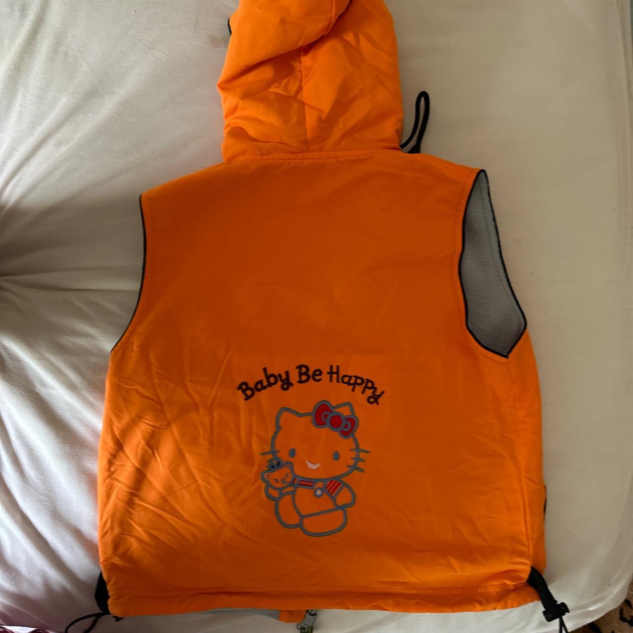 Rare orange hello kitty vest has small stain in... - Depop