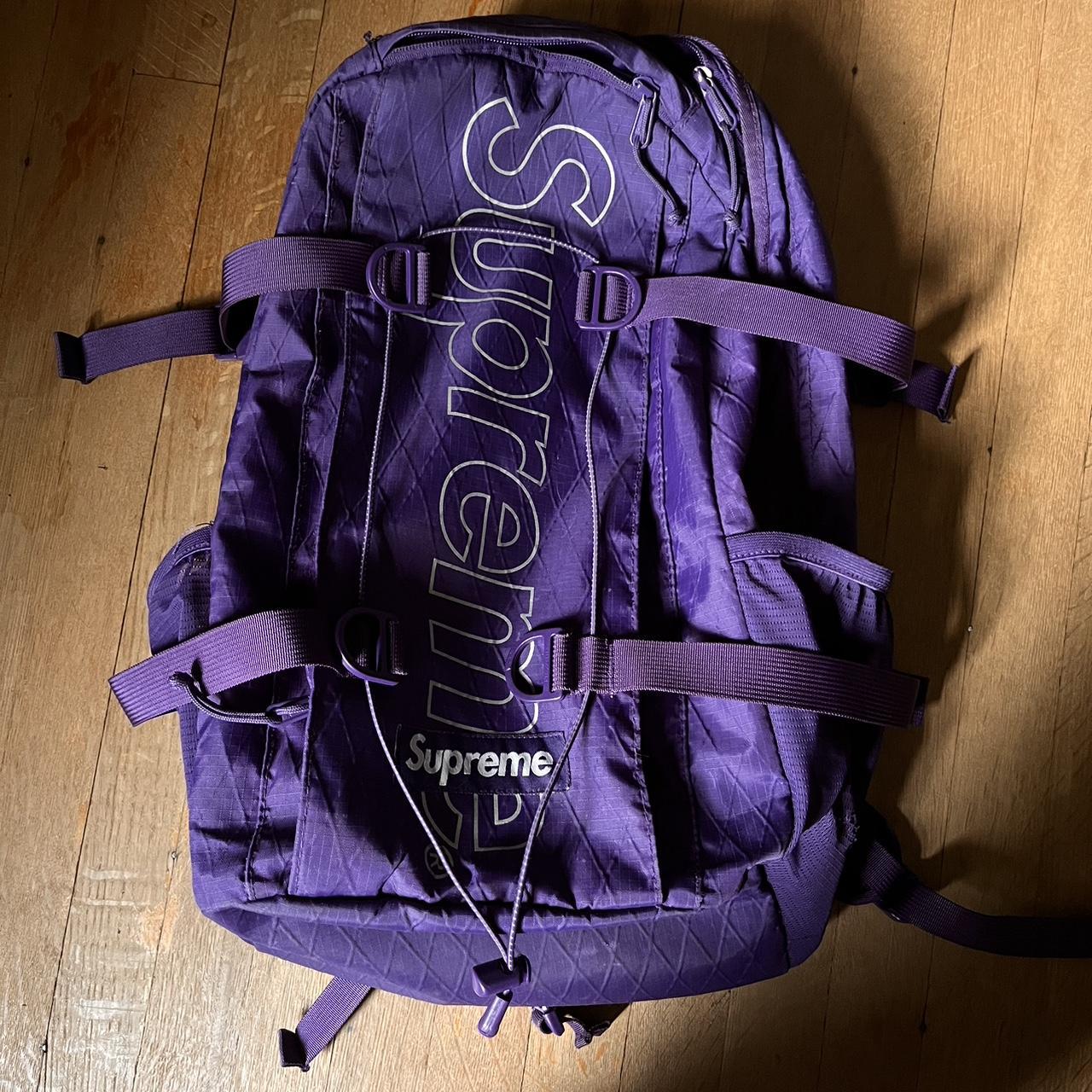Supreme FW18 purple backpack A few holes on the... - Depop