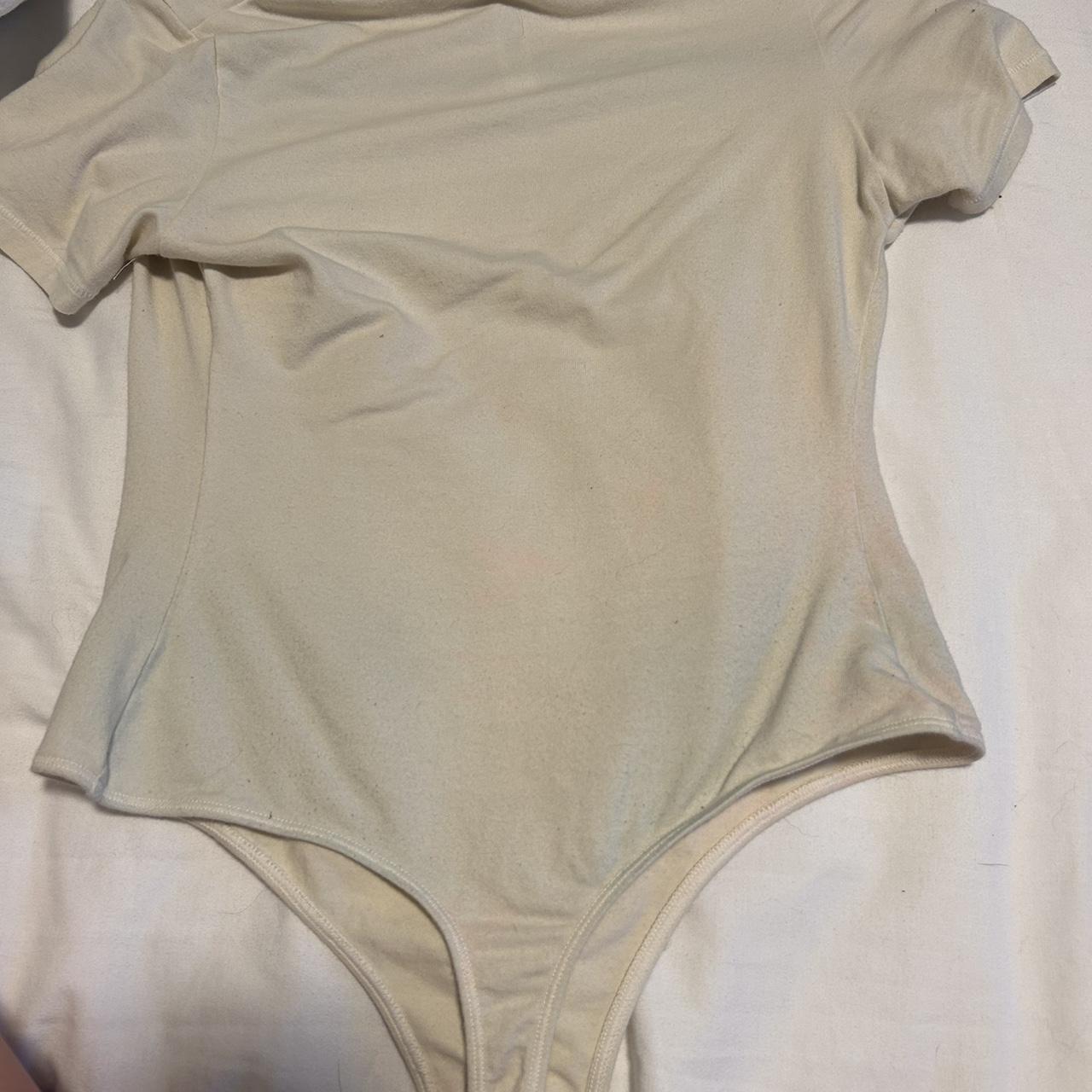 Skims cream T-shirt bodysuit Size M Pink stain on... - Depop