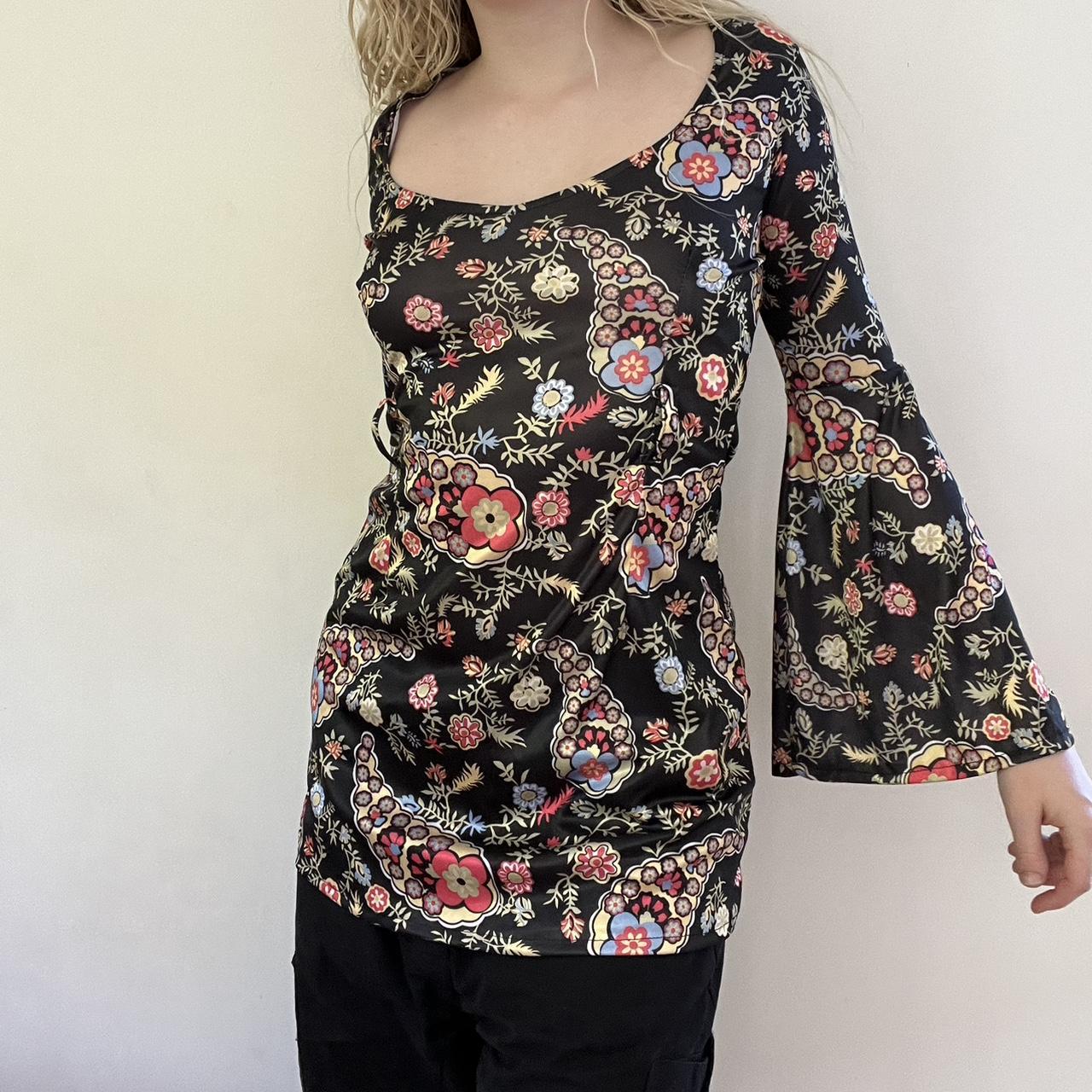 Woman’s small black multi coloured pattern flares... - Depop