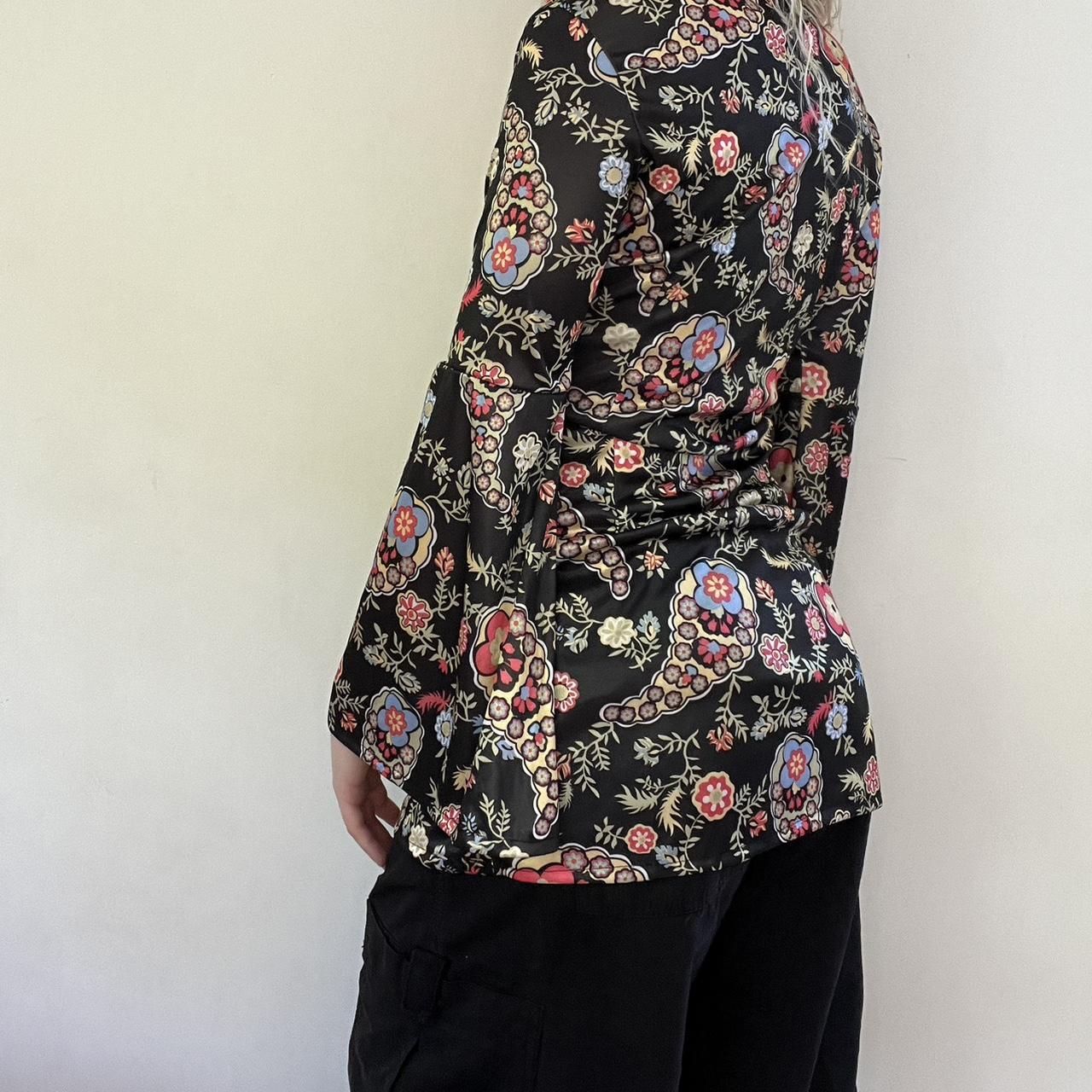 Woman’s small black multi coloured pattern flares... - Depop