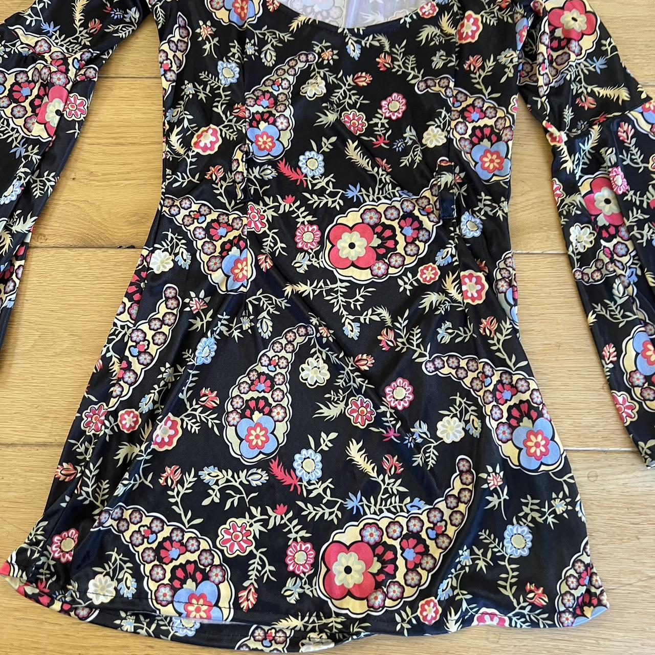 Woman’s small black multi coloured pattern flares... - Depop