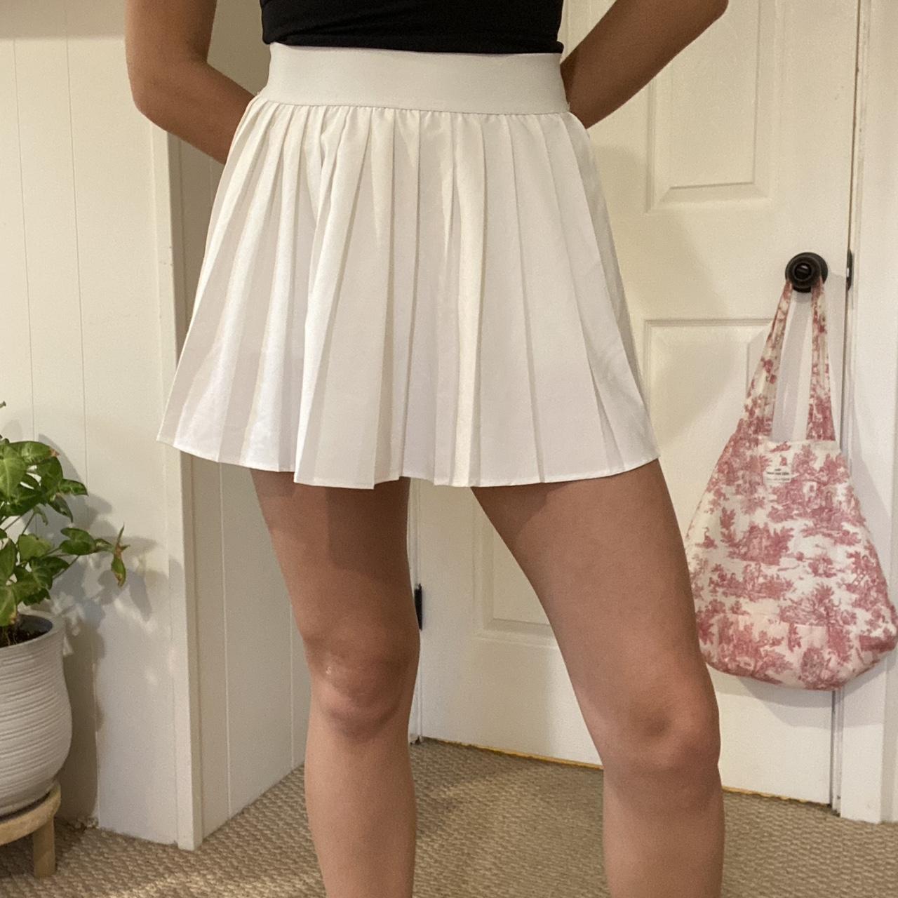 GARAGE white pleated tennis skort size Small Never... - Depop