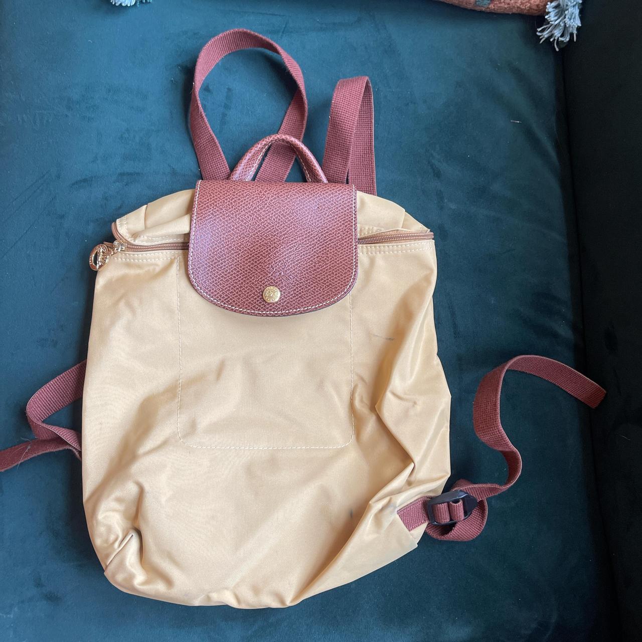 Longchamp tan backpack. Some markings as seen in... - Depop