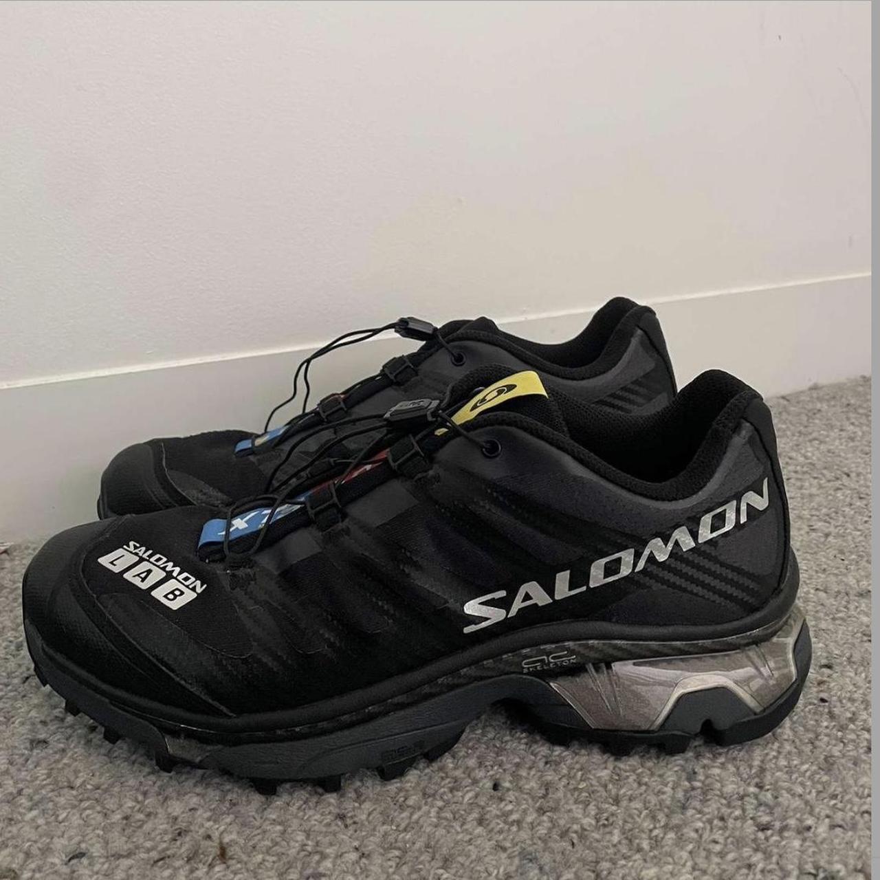 Super cool black salomons with metallic detailing... - Depop