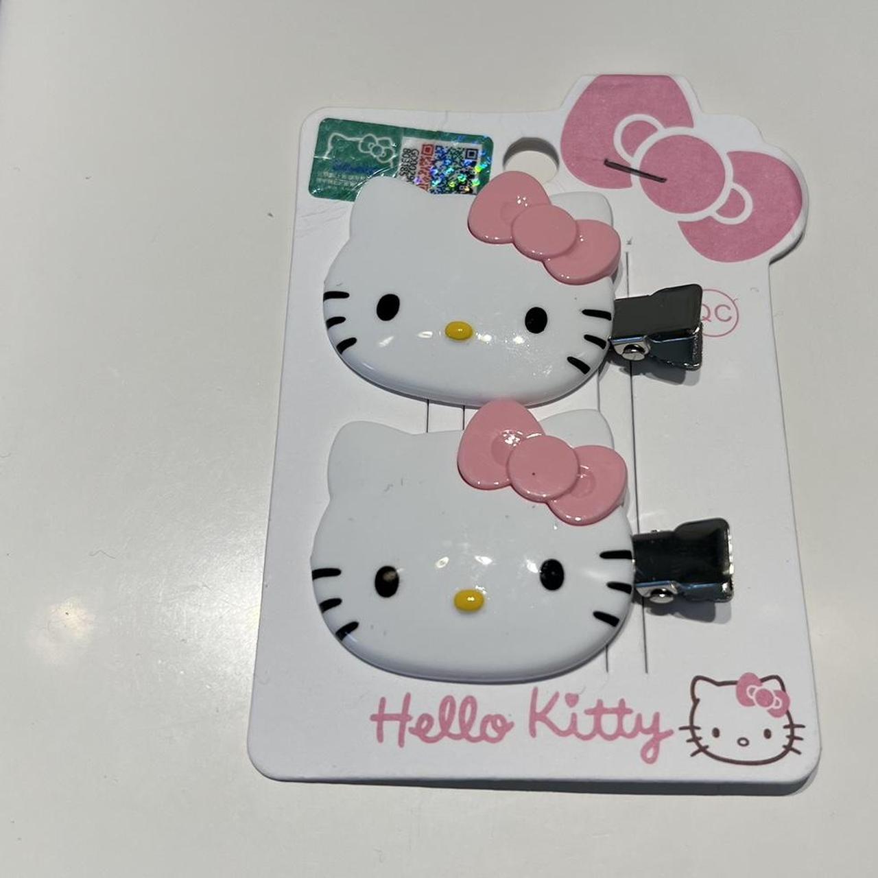 Hello kitty hair clips... - Depop