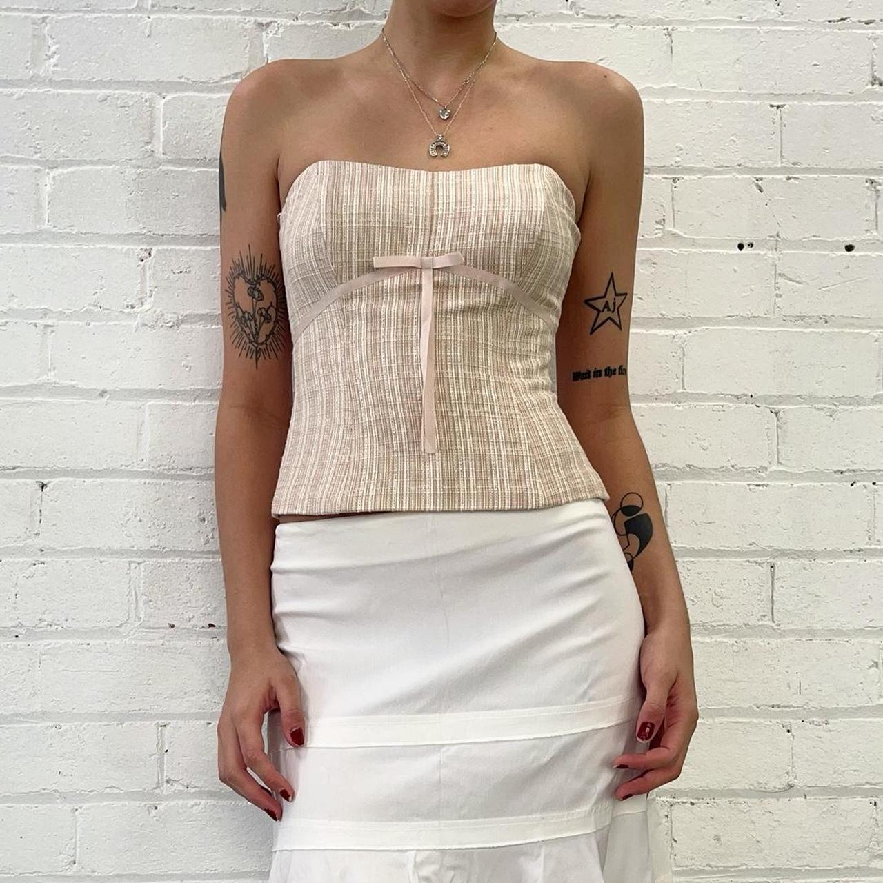 Baby pink bow corset top This top is strapless and... - Depop
