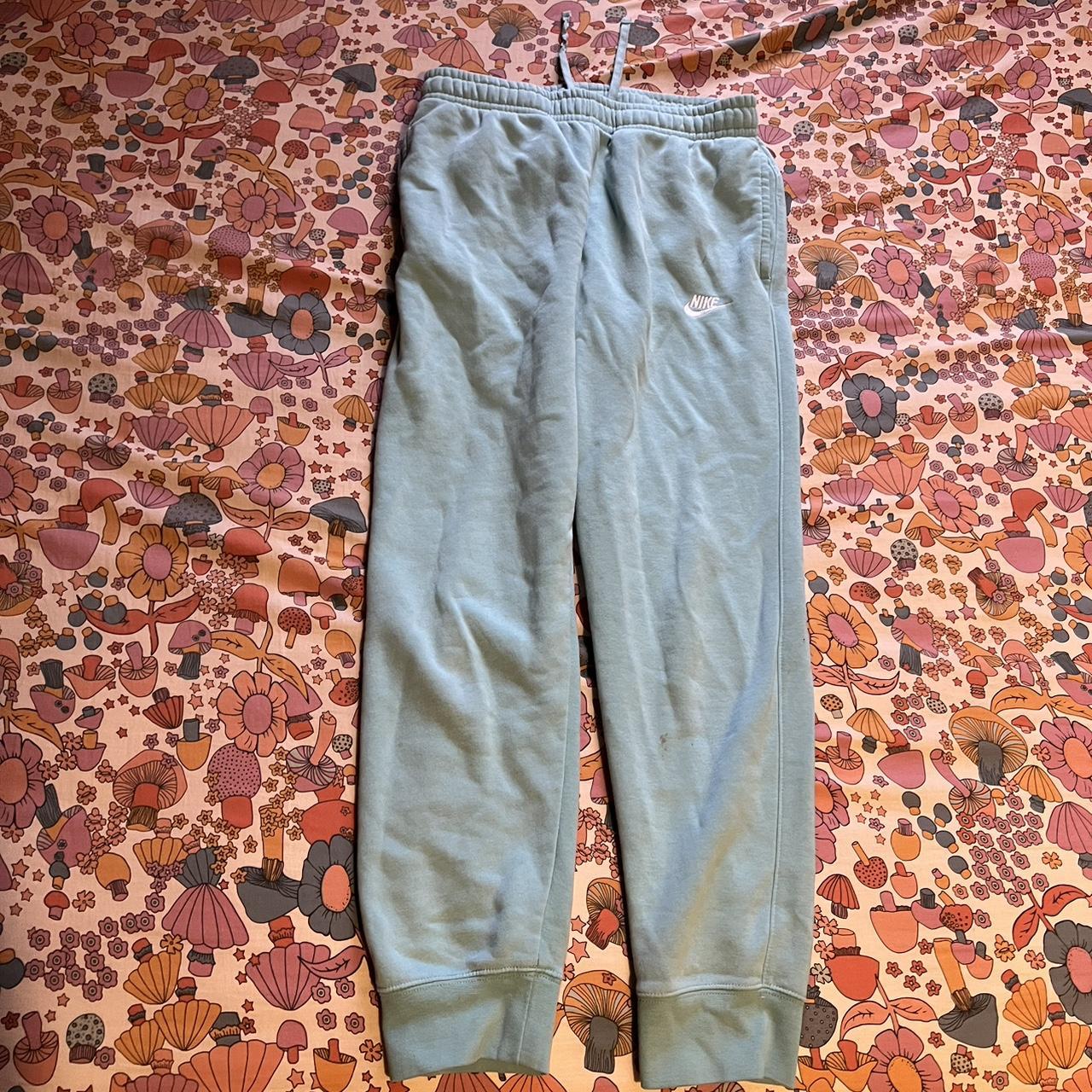 Teal Nike sweats, tiny red spot of hairdye on bottom... - Depop