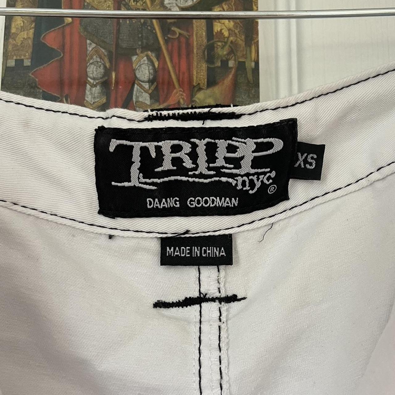 White and Black Tripp NYC pants with chains, never... - Depop