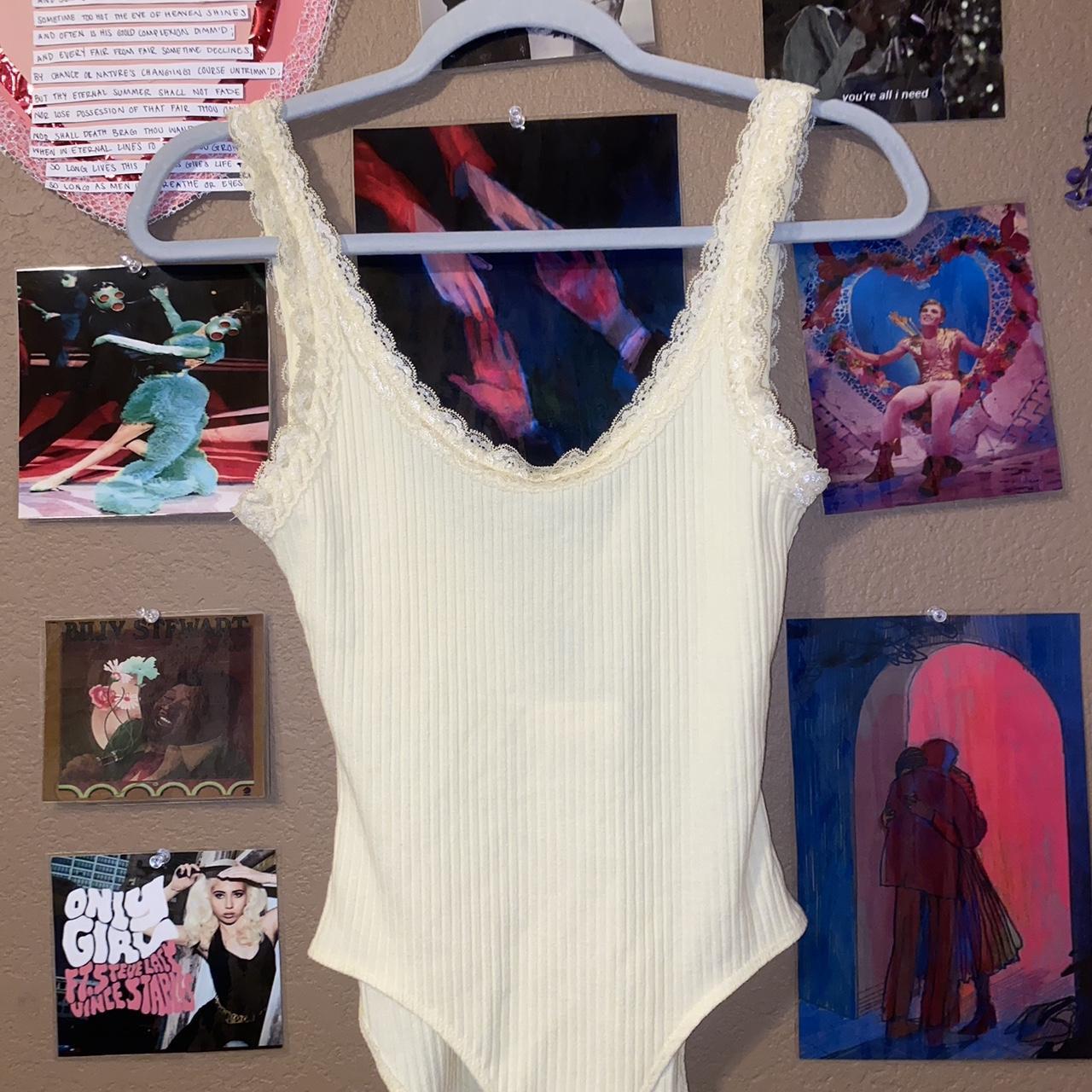 Pale yellow body suit brand new with tags from... - Depop