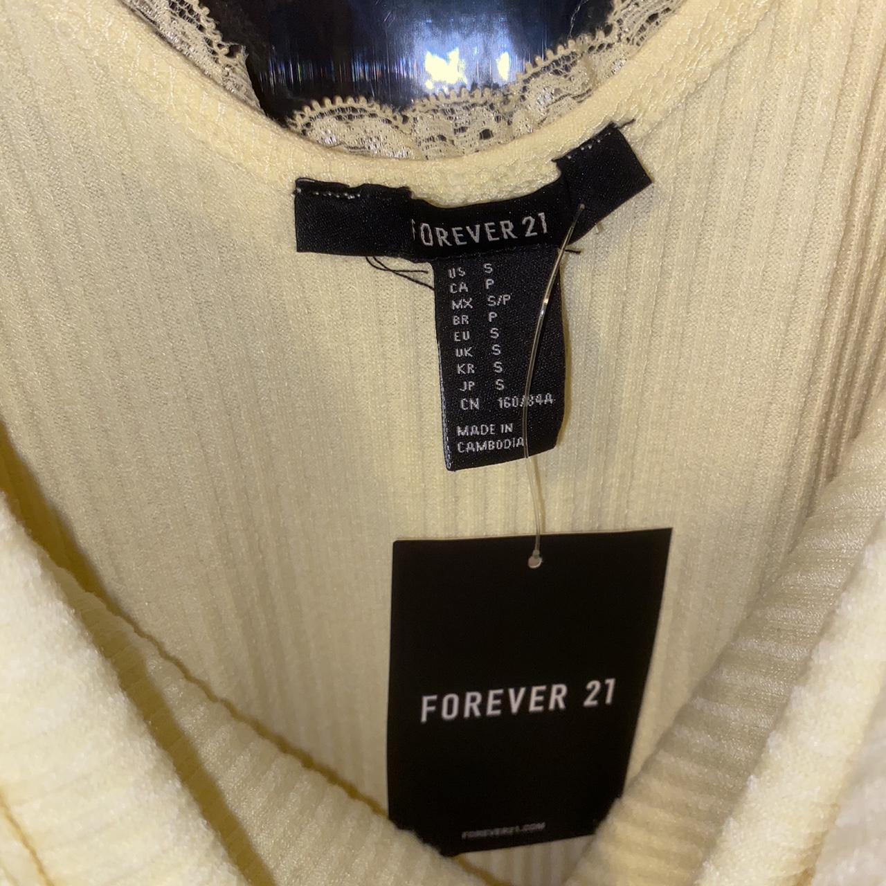 Pale yellow body suit brand new with tags from... - Depop