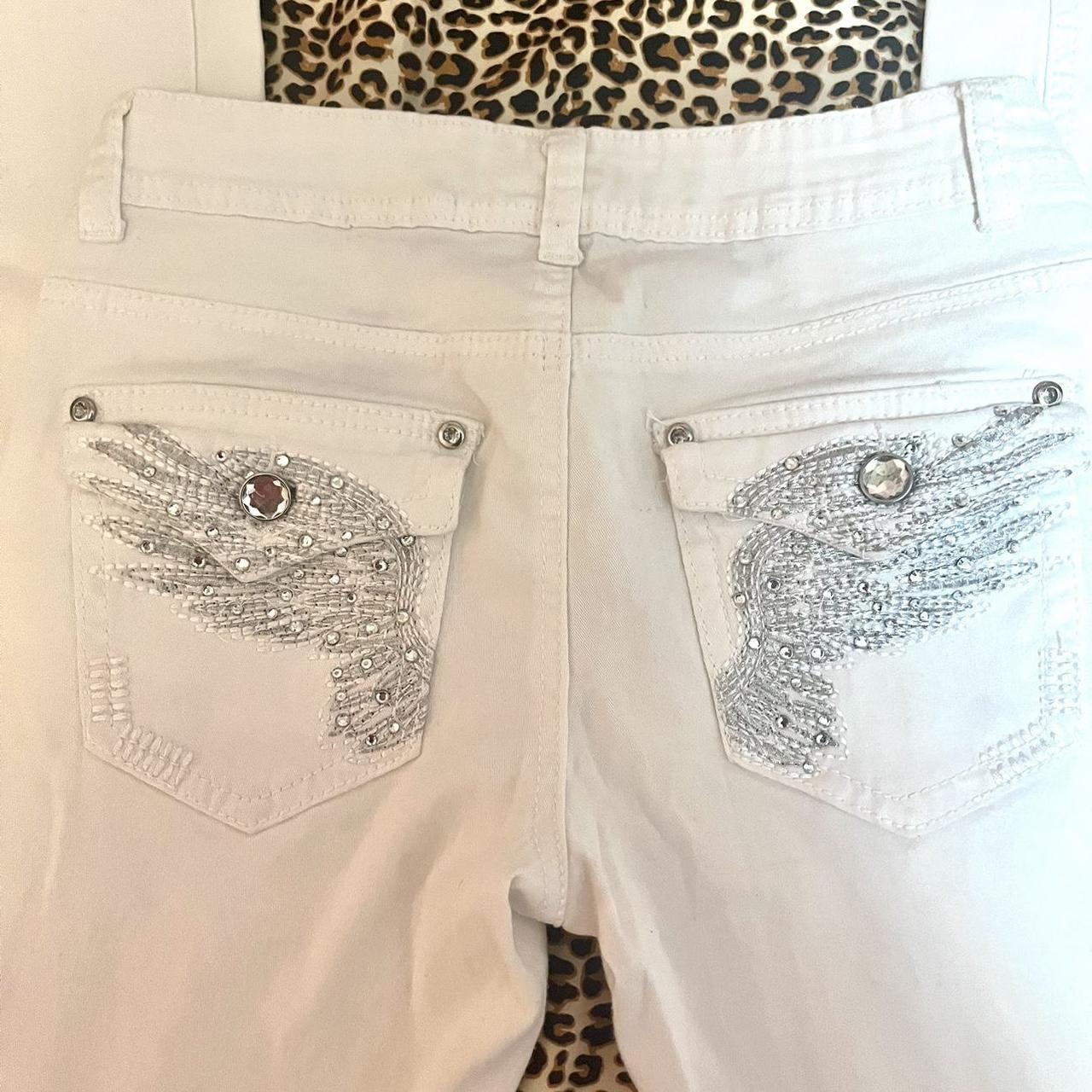 Angel wings on pocket white skinny jeans #cybery2k... - Depop