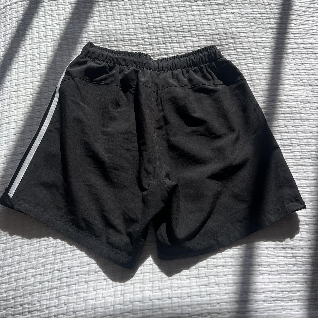 Adidas black shorts with white stripes Men’s size... - Depop