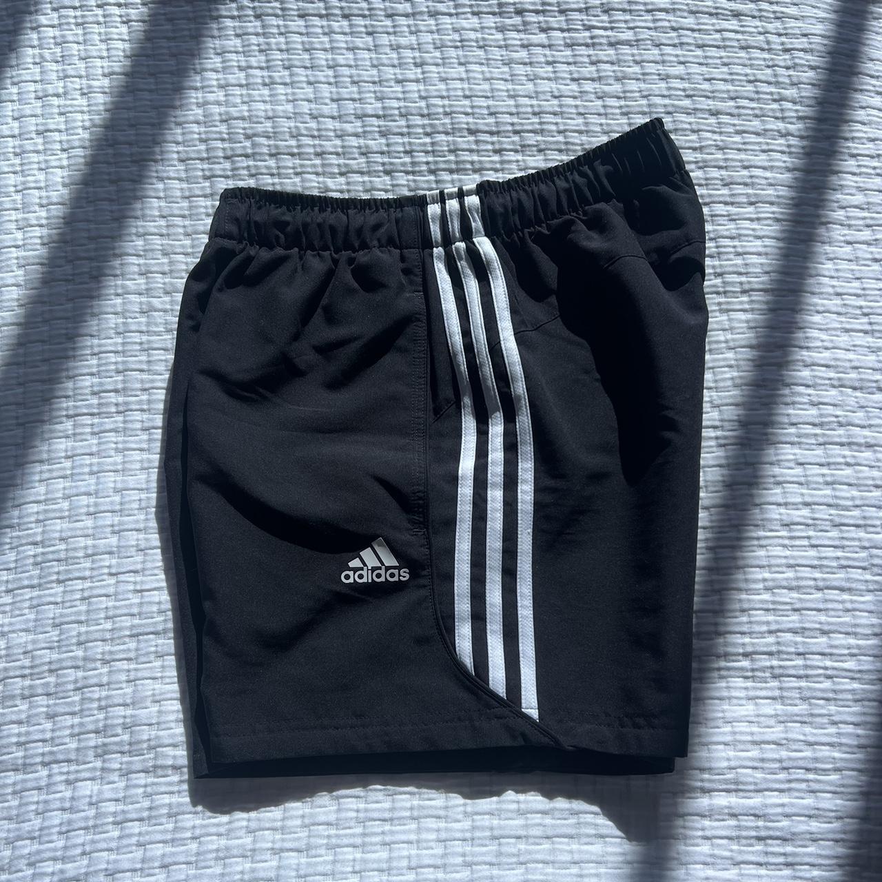 Adidas black shorts with white stripes Men’s size... - Depop