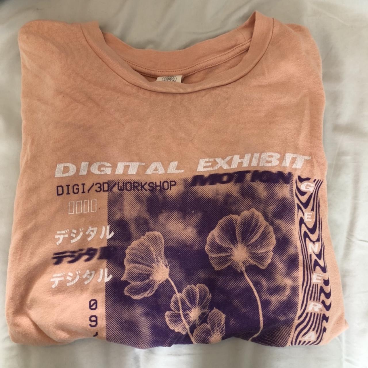 pale peach coloured graphic tee from urban... | Depop