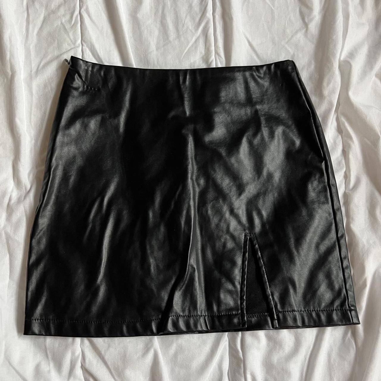 Black faux leather mini skirt with mini leg slit... - Depop
