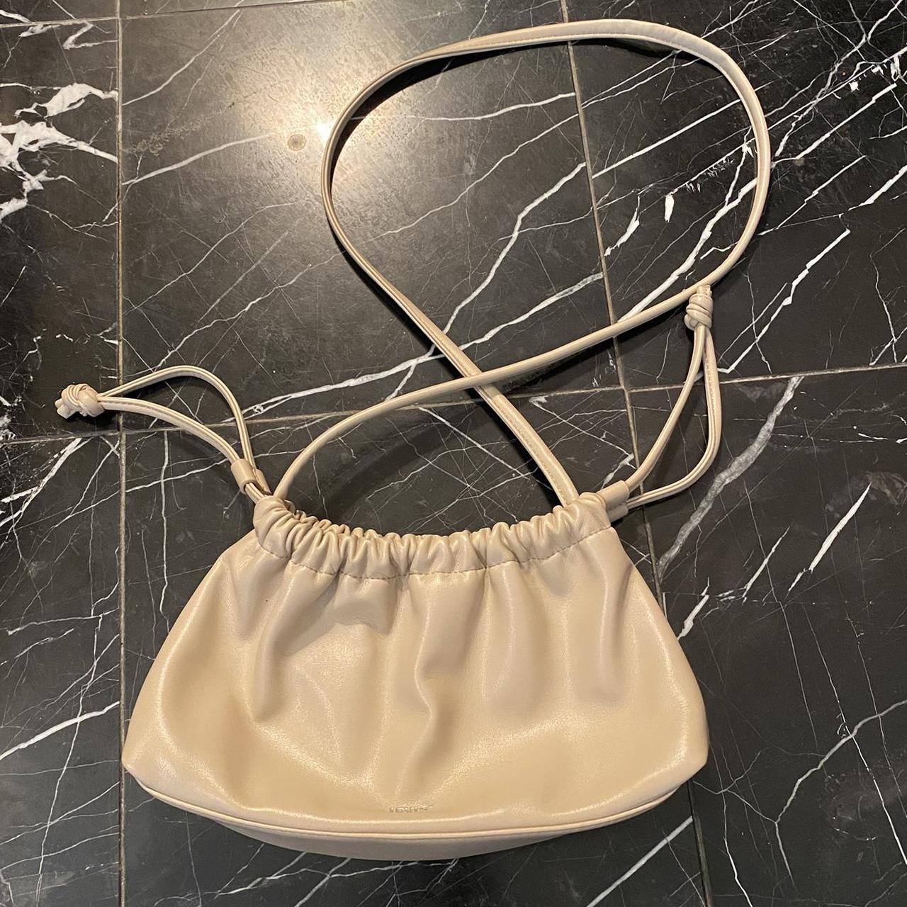 Levi’s brand tan purse. Cinch closure with the... - Depop