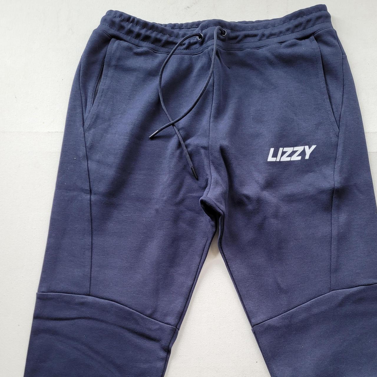 navy blue Lizzy road tech jogger bottoms. medium... - Depop