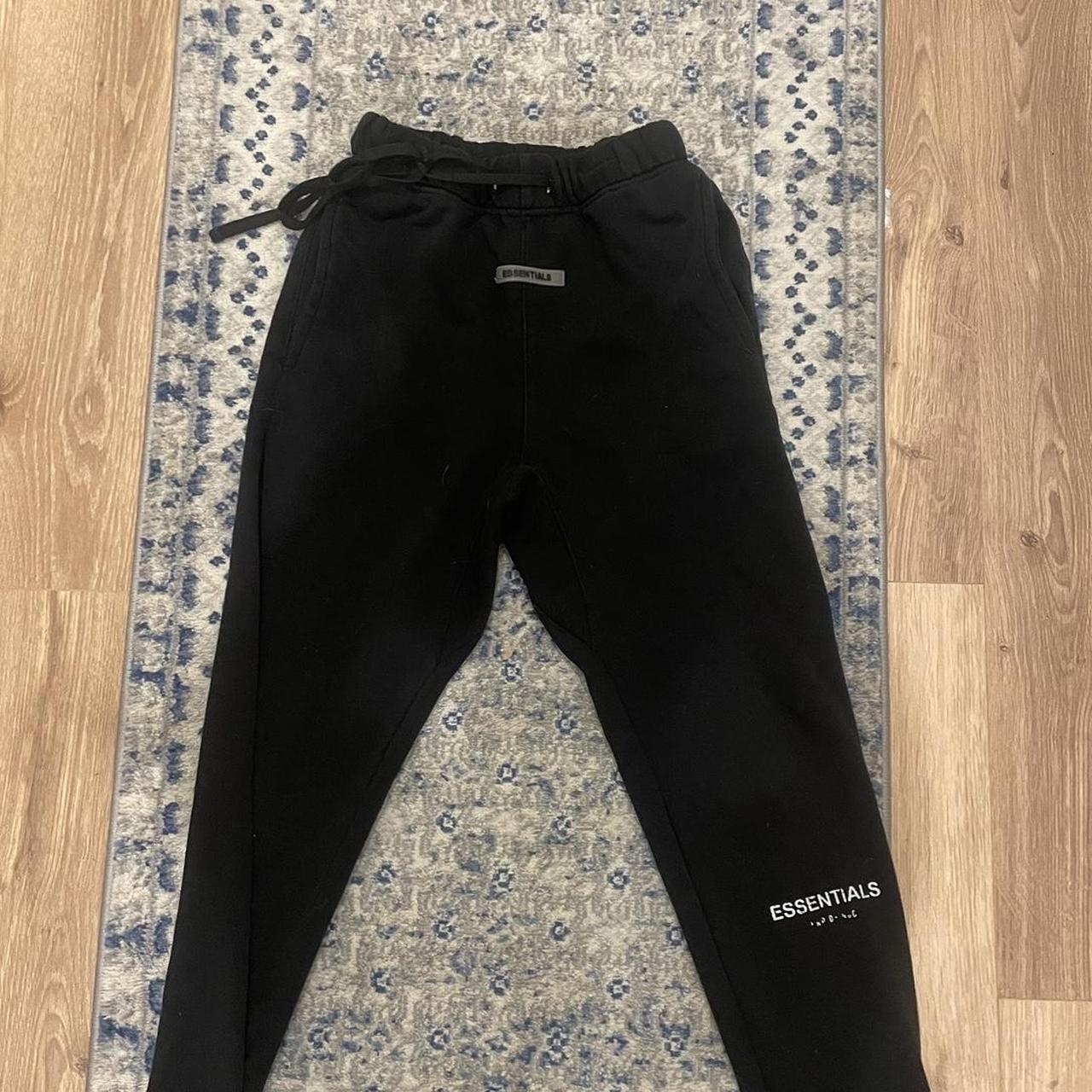essentials sweatpants. some wear on the lettering... - Depop
