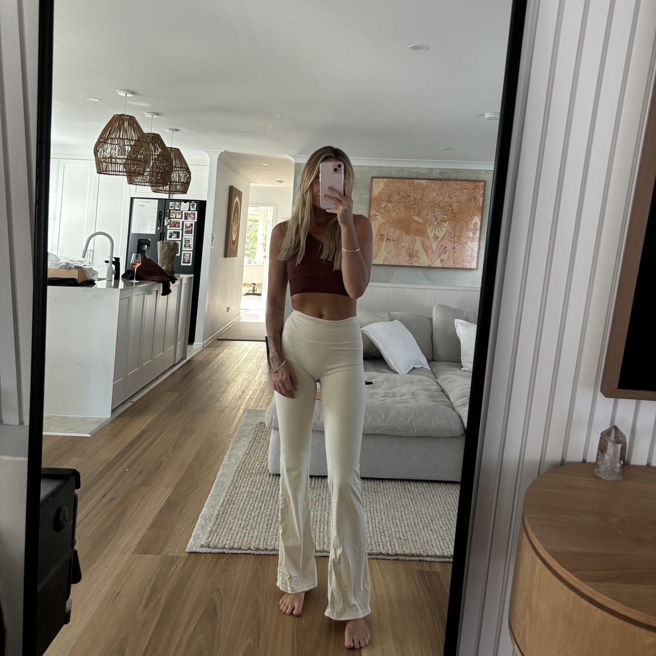 Cream flared active pants - Depop