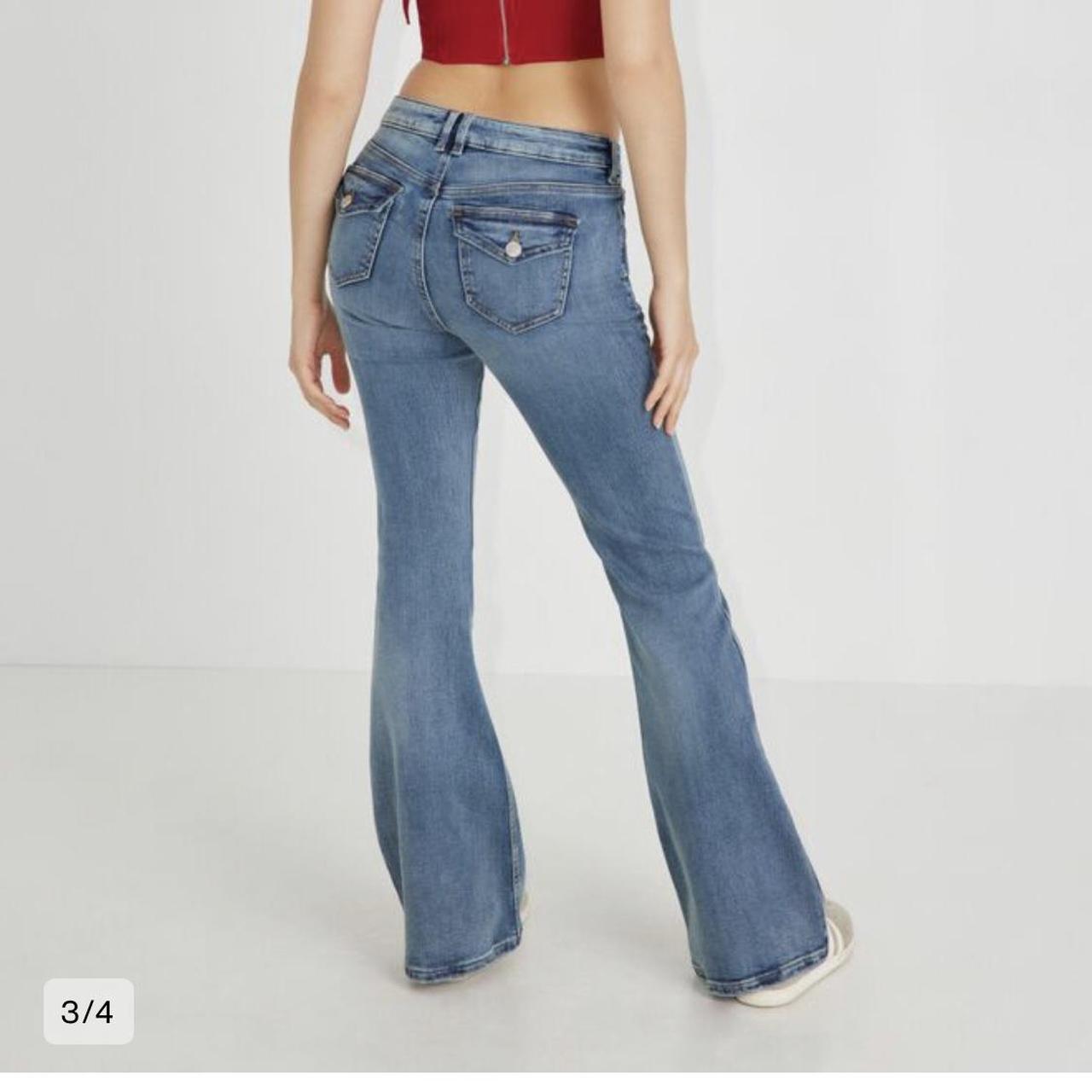 Low rise flare jeans Garage Medium Blue Size... - Depop