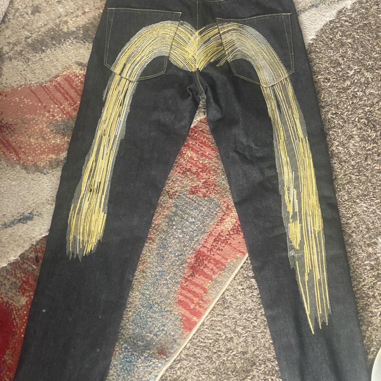 Dark blue Evisu Jeans with yellow stitched M. There... - Depop