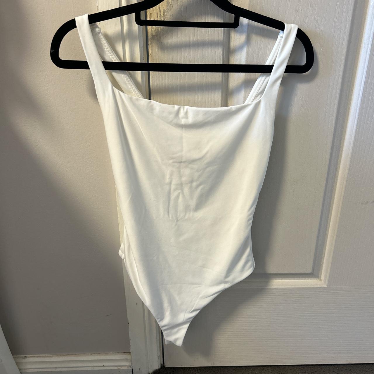 White glassons bodysuit size s never worn as it was... - Depop