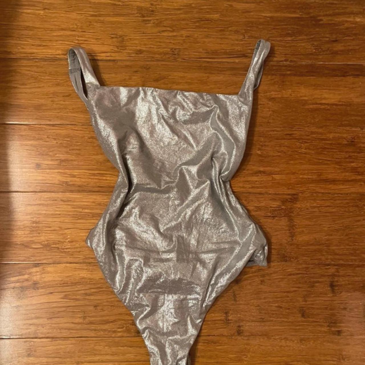 Skims silver metallic bodysuit. Super cute and never... - Depop