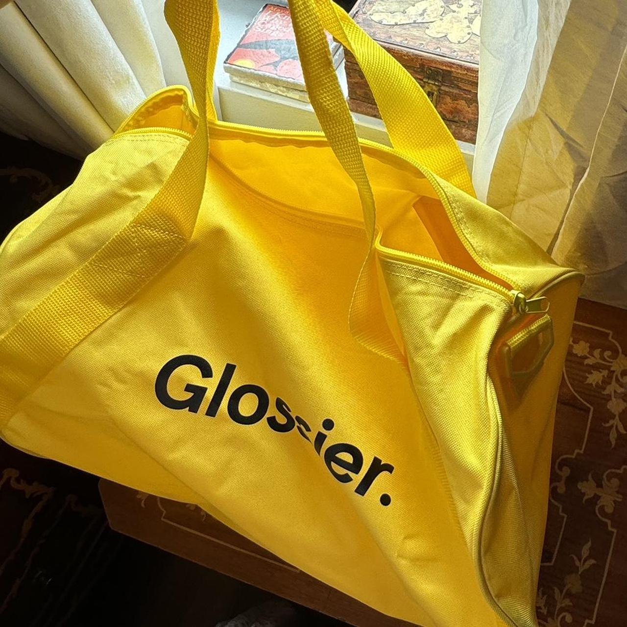 Glossier yellow duffle bag with shoulder and hand... - Depop