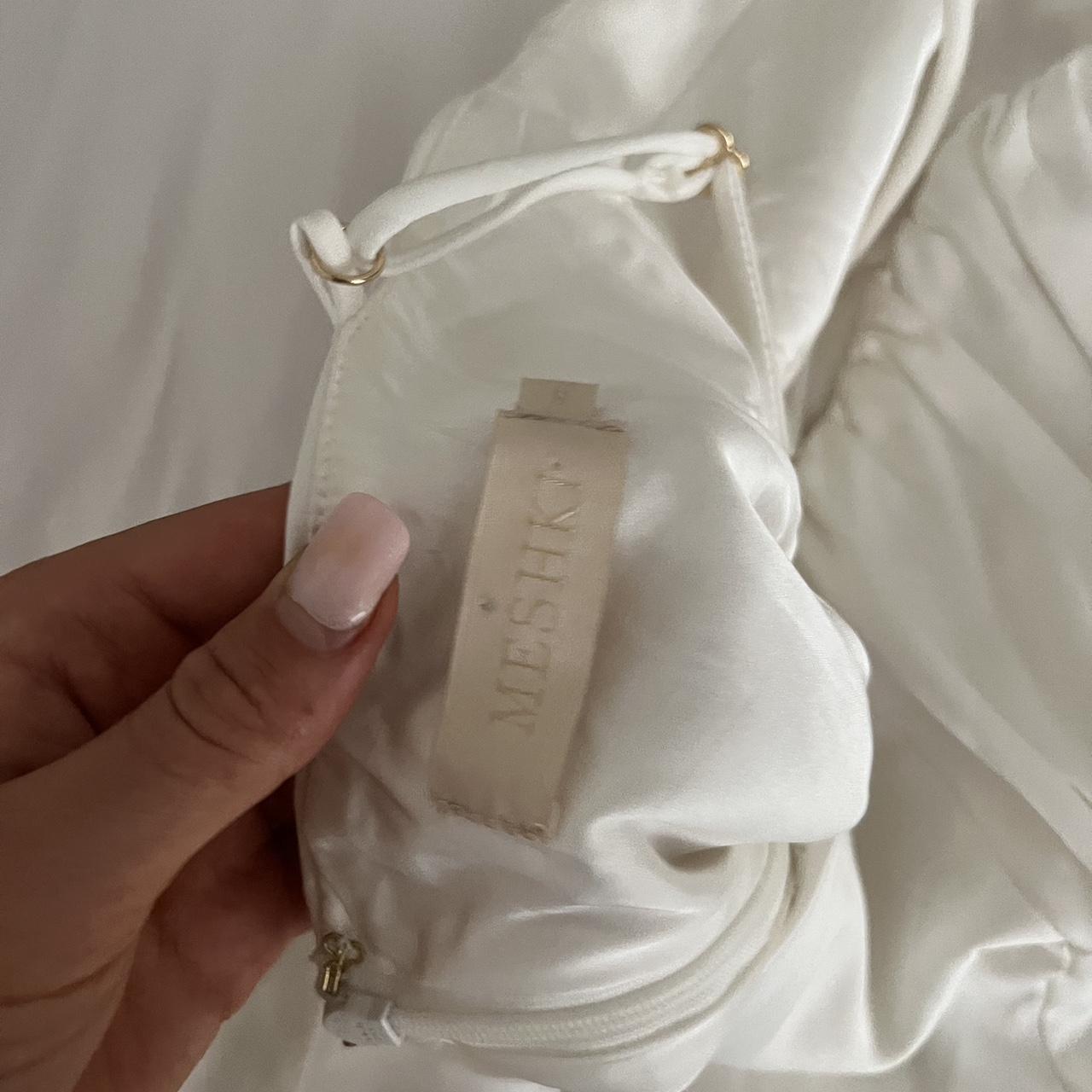 White meshki bodycon… small hole at the base of the... - Depop