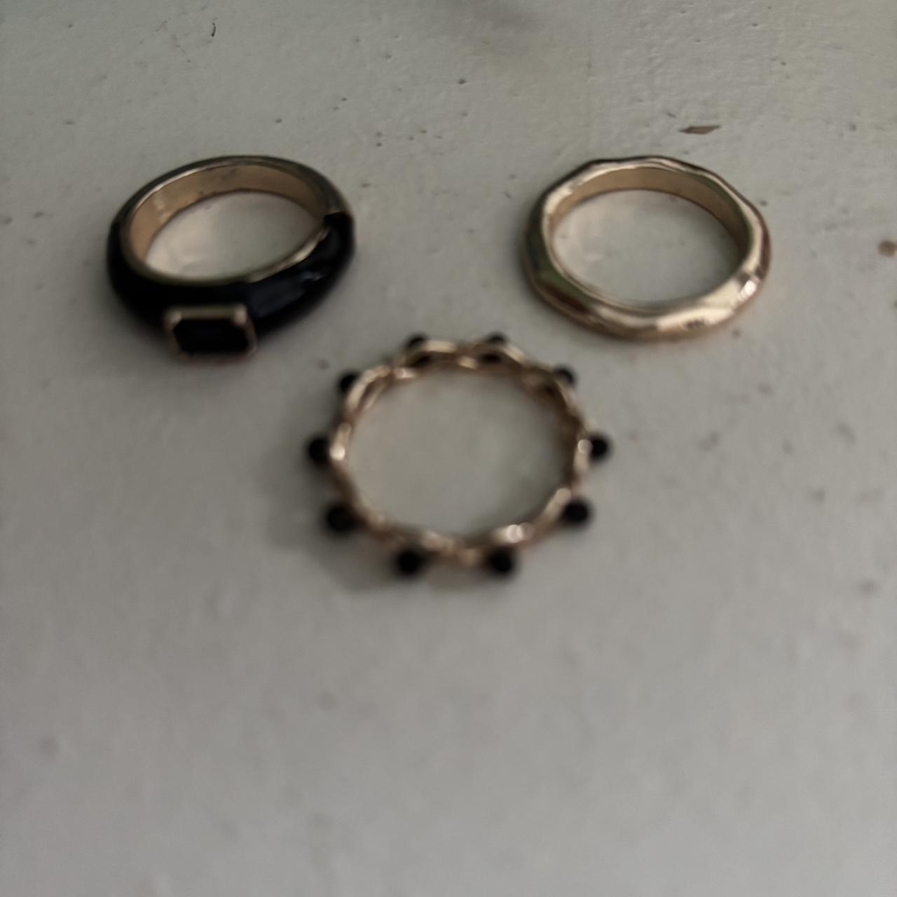 Gold and black ring set from Lovisa- size... - Depop