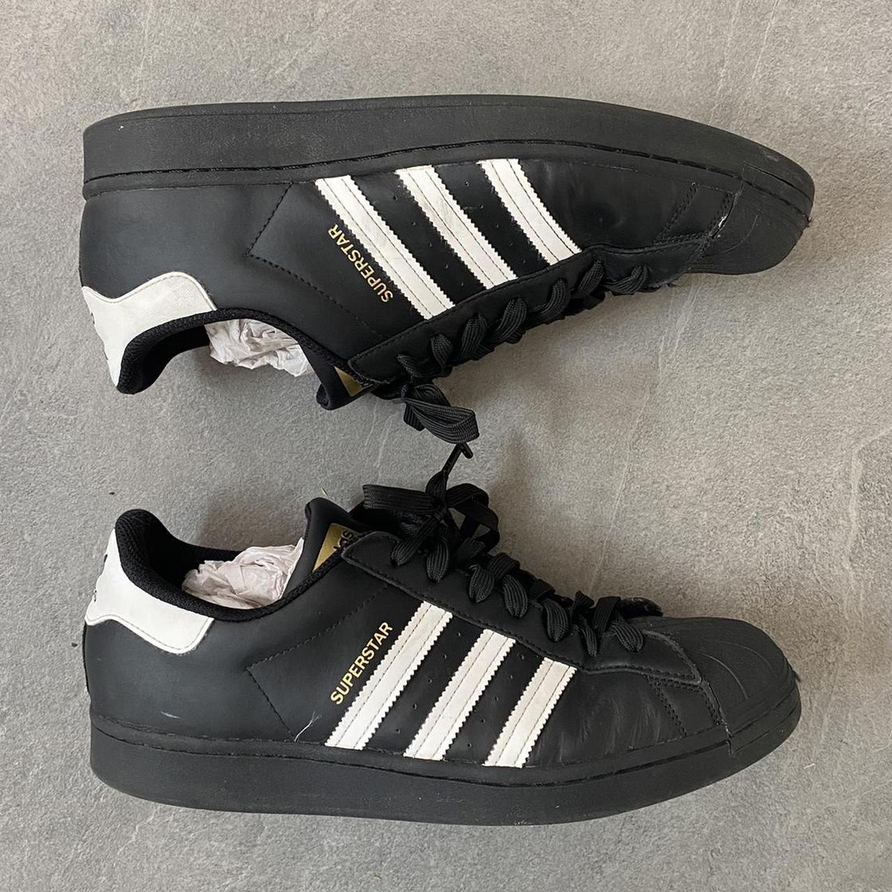 addias superstars black and white stripe with gold... - Depop