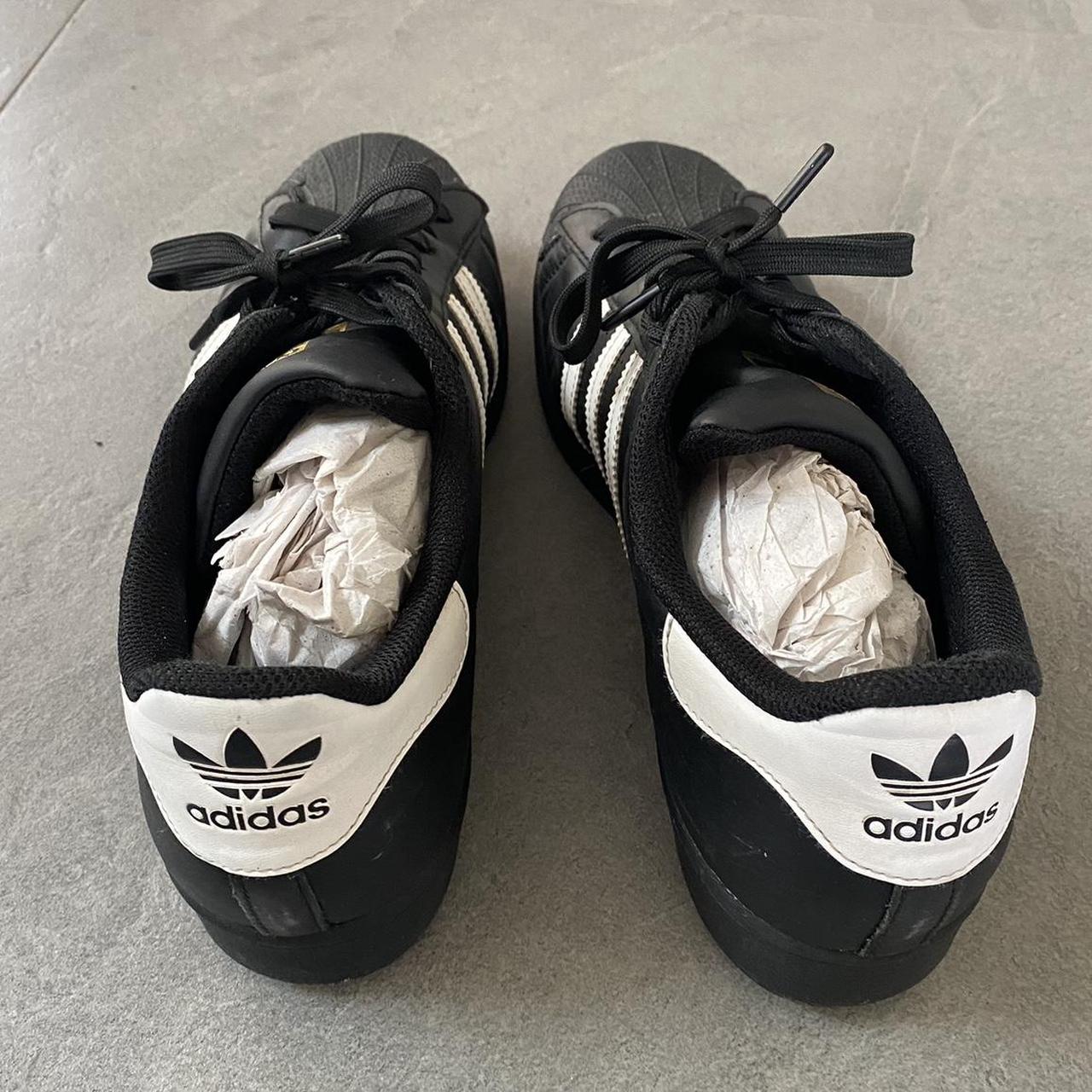 addias superstars black and white stripe with gold... - Depop