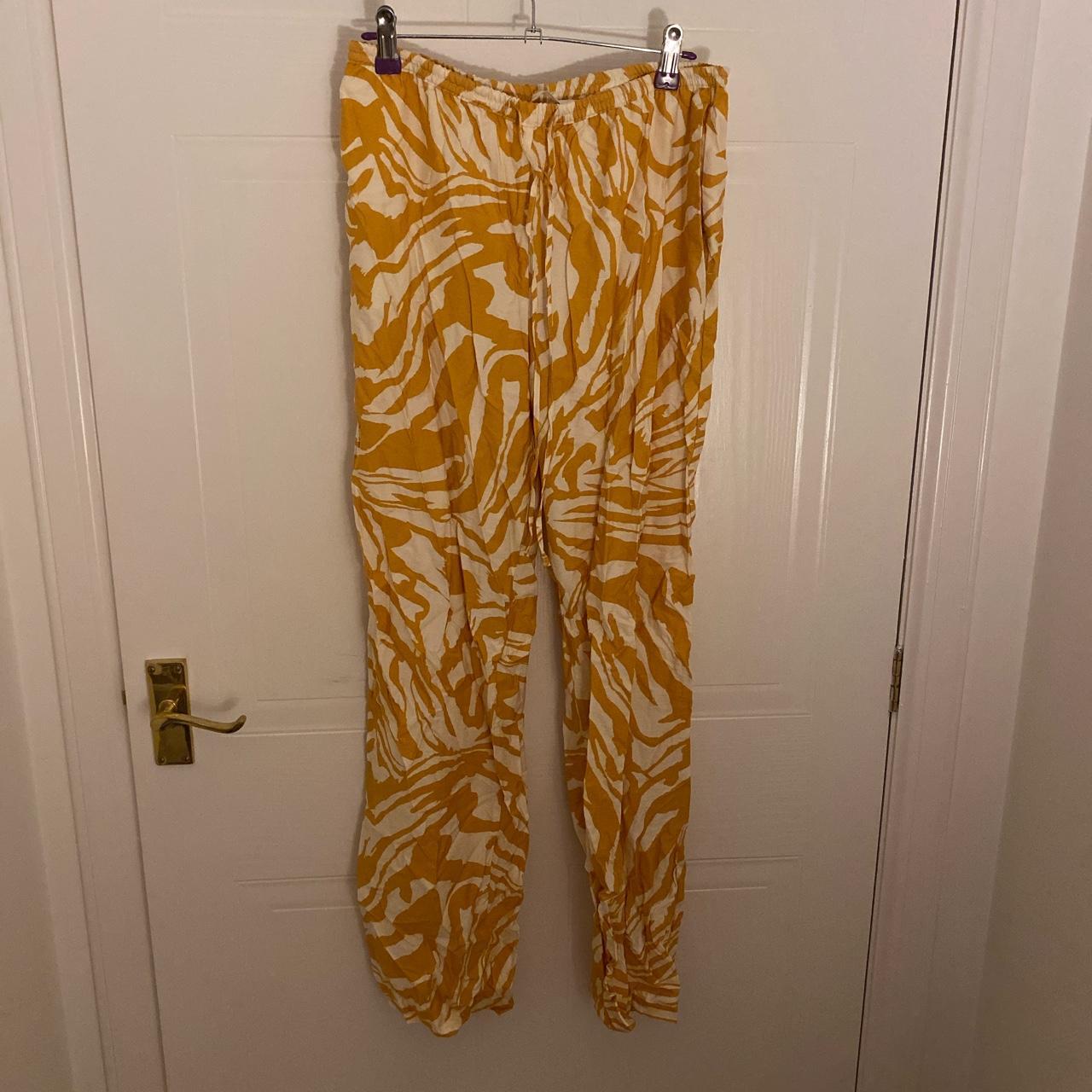 Orange and white drawstring waist trousers from H&M.... - Depop