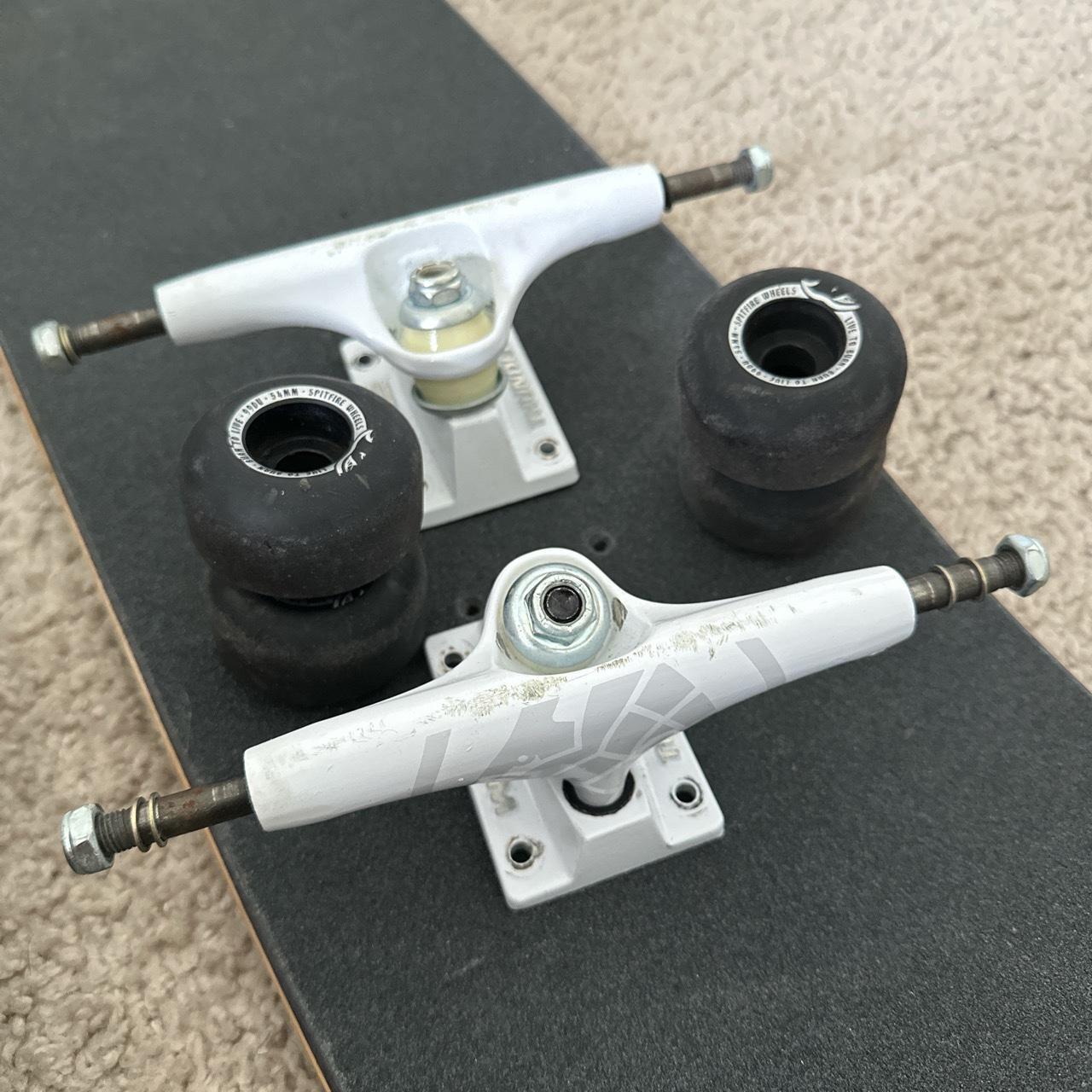 Used White Thunder Trucks size T147 with Black 54mm... | Depop