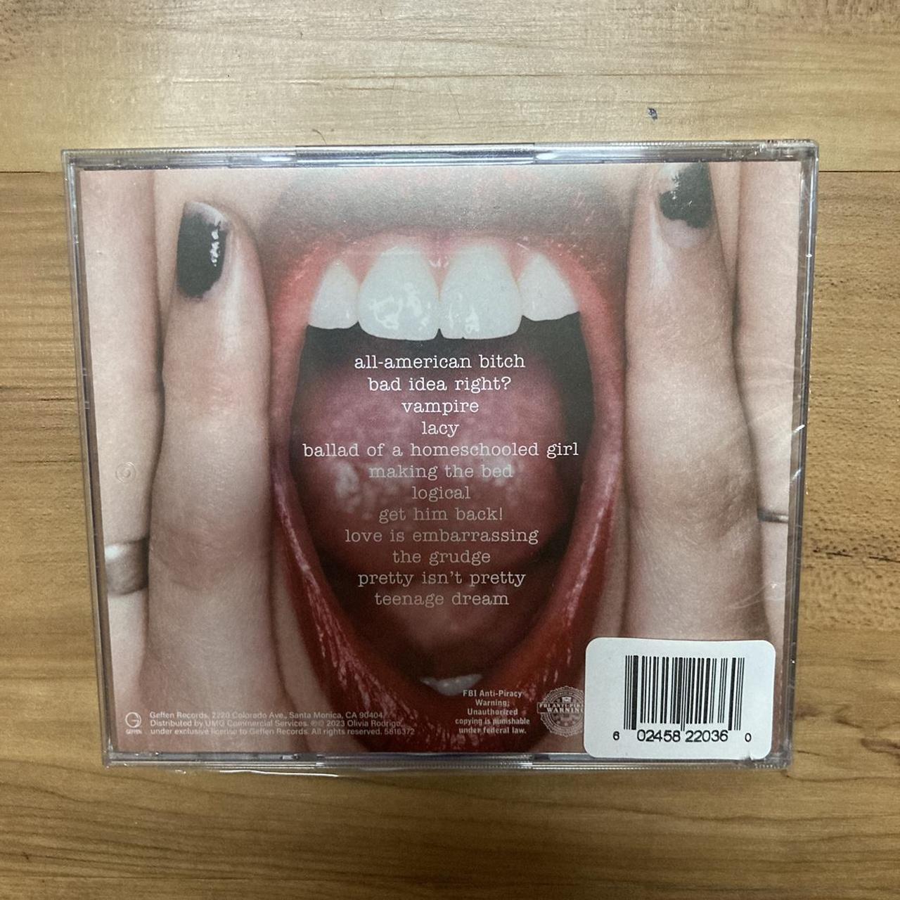 OLIVIA RODRIGO HAND SIGNED AUTOGRAPHED GUTS CD NEW... - Depop