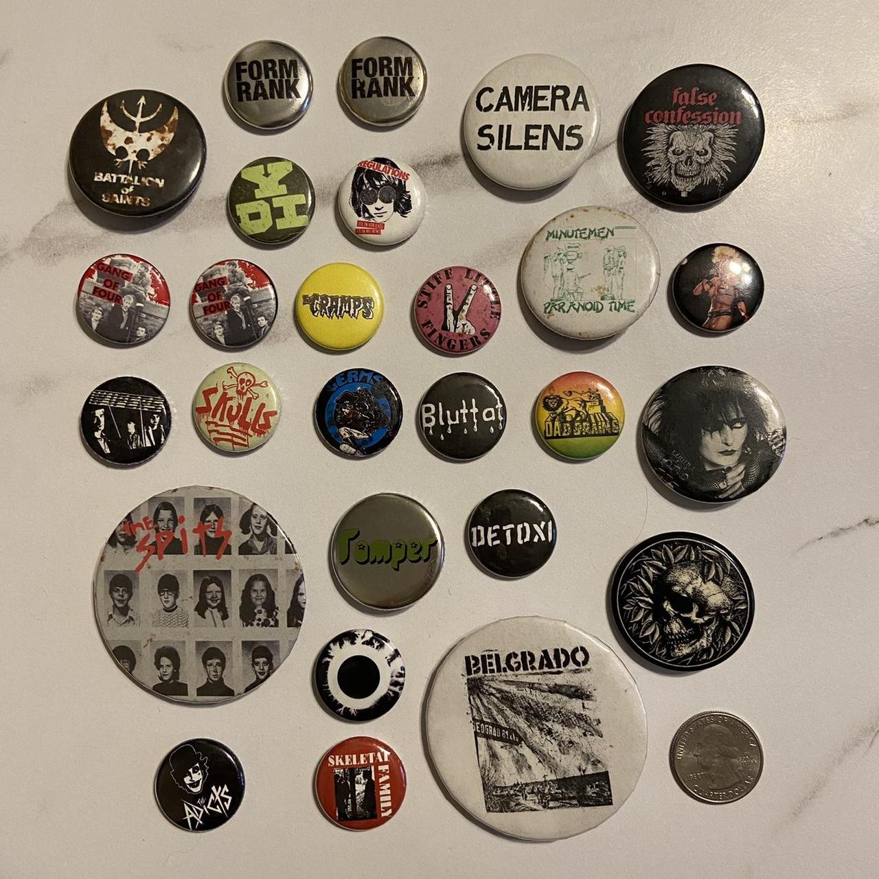 Lot of various punk buttons. Quarter for size... - Depop