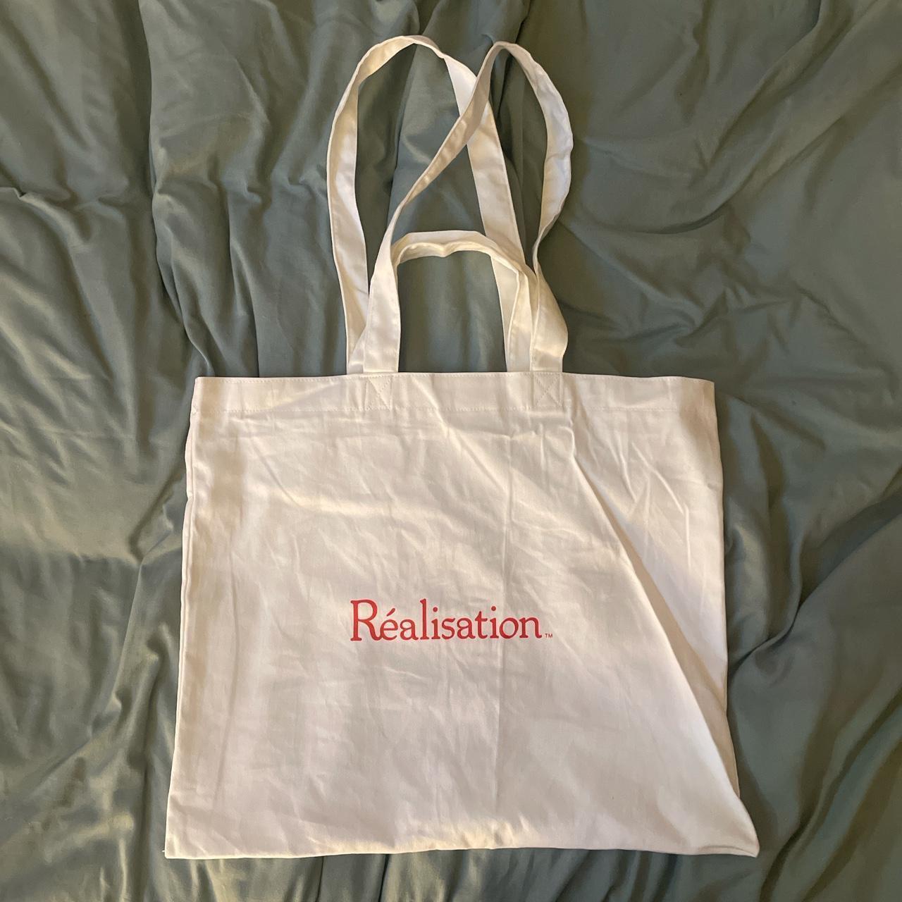 Réalisation Par Red and White Tote Bag features two... - Depop