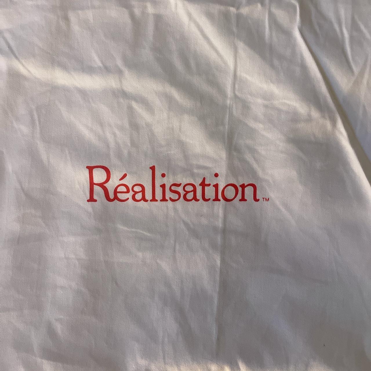 Réalisation Par Red and White Tote Bag features two... - Depop