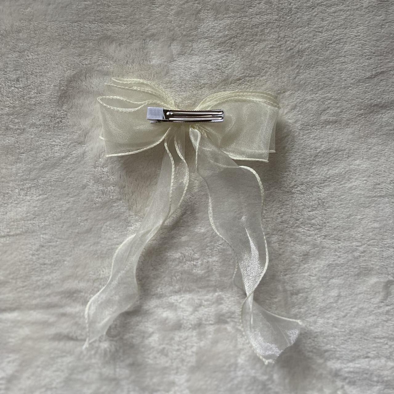 NEW, UNUSED urban large white cream ribbon bow clip... - Depop